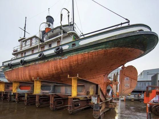 Wooden, steam-powered tugboat being restored for 100th birthday
